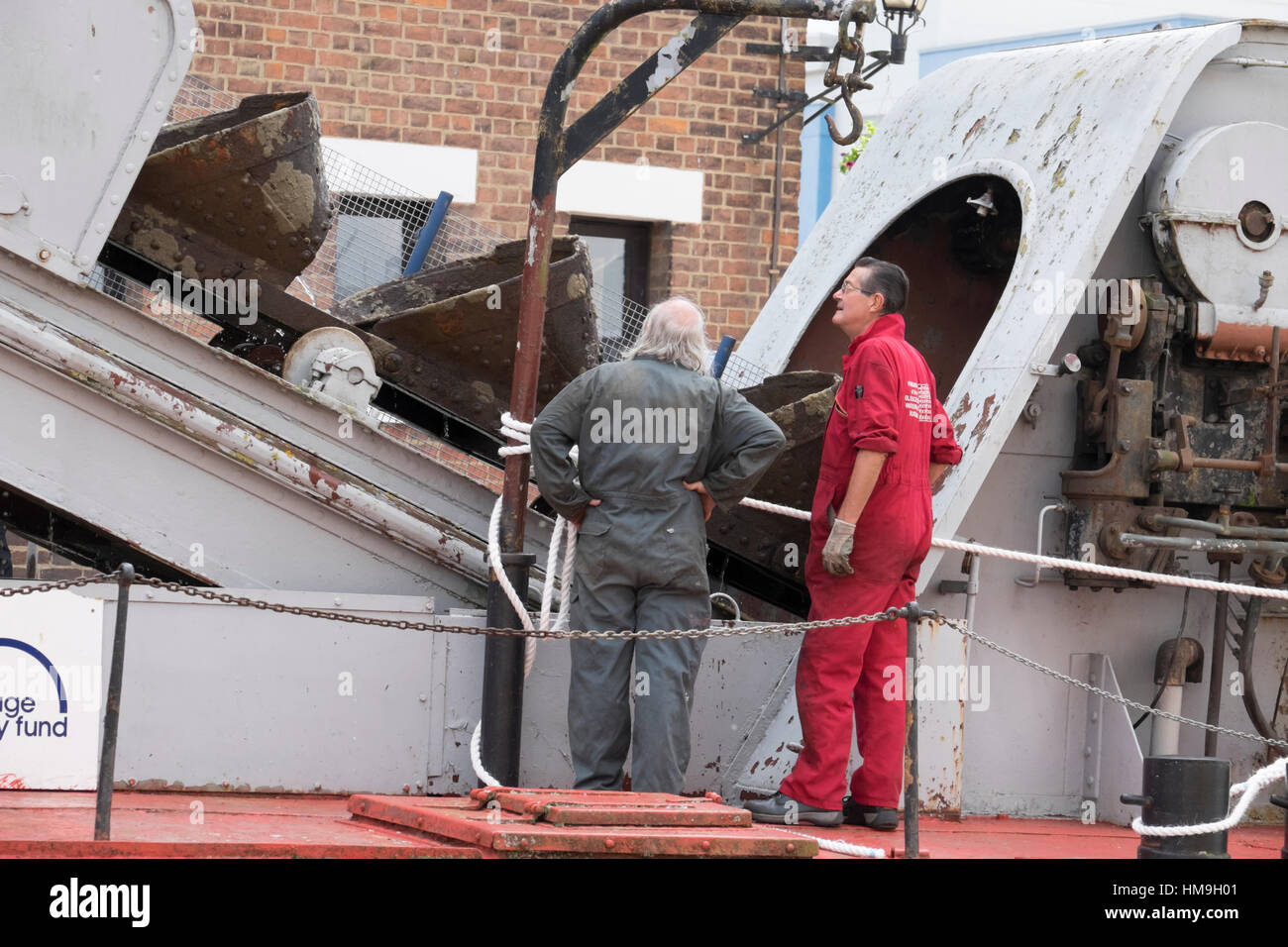 Volunteers working on a historic steam dredger in Gloucester docks ...