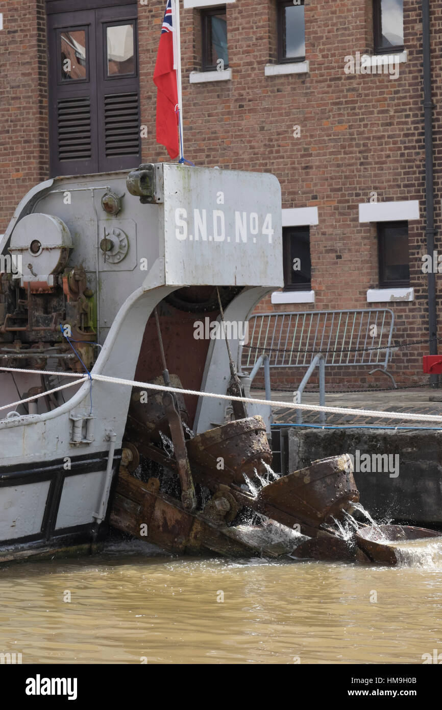Volunteers working on a historic steam dredger in Gloucester docks ...