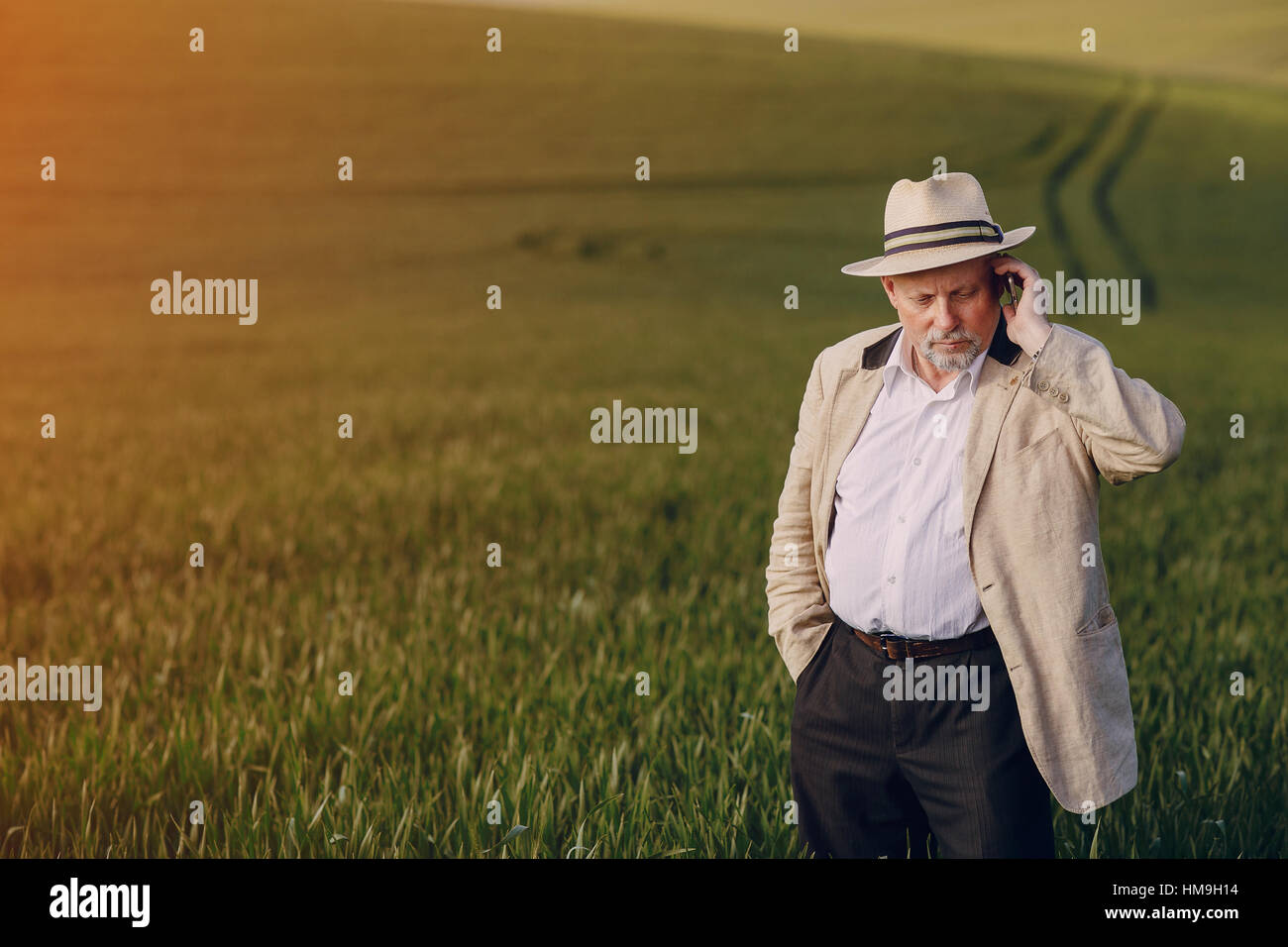 old man in field Stock Photo - Alamy