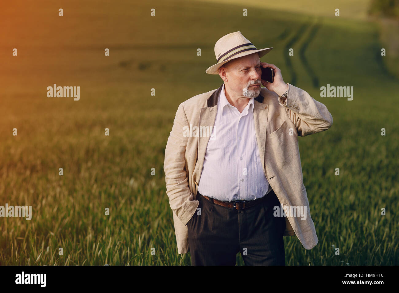 old man in field Stock Photo - Alamy
