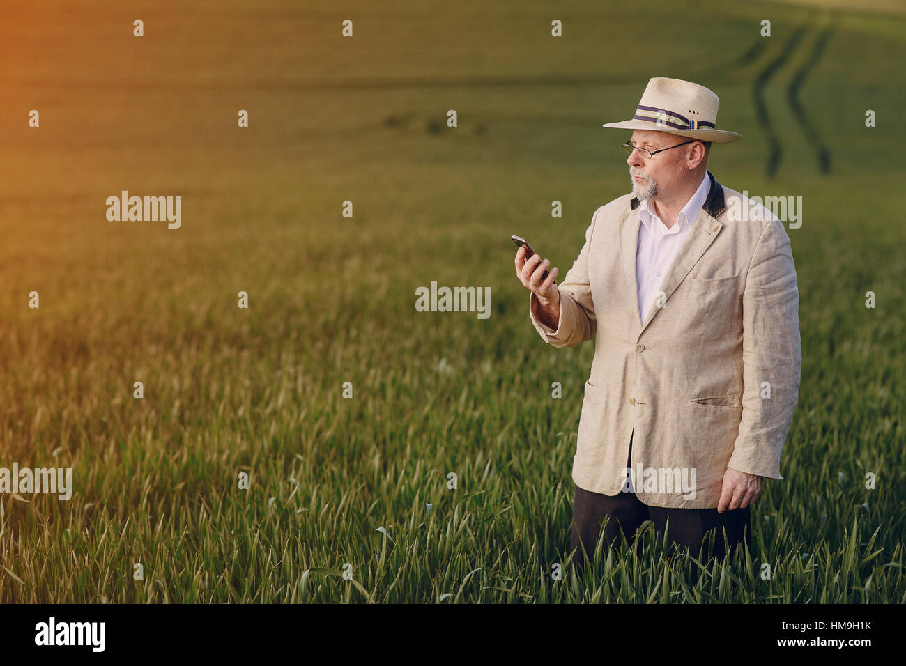 old man in field Stock Photo - Alamy