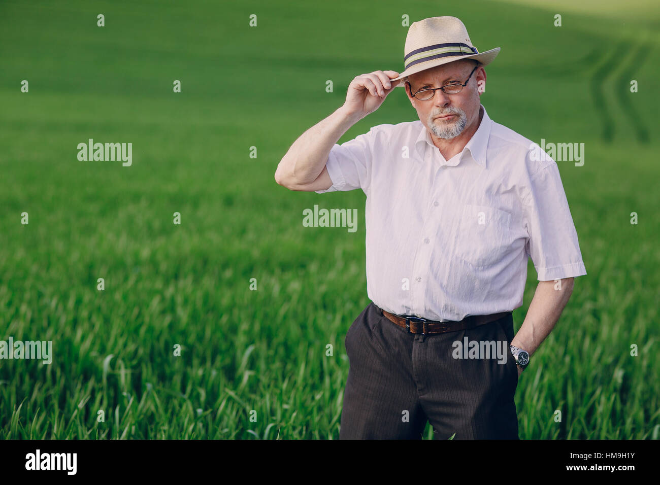 old man in field Stock Photo - Alamy