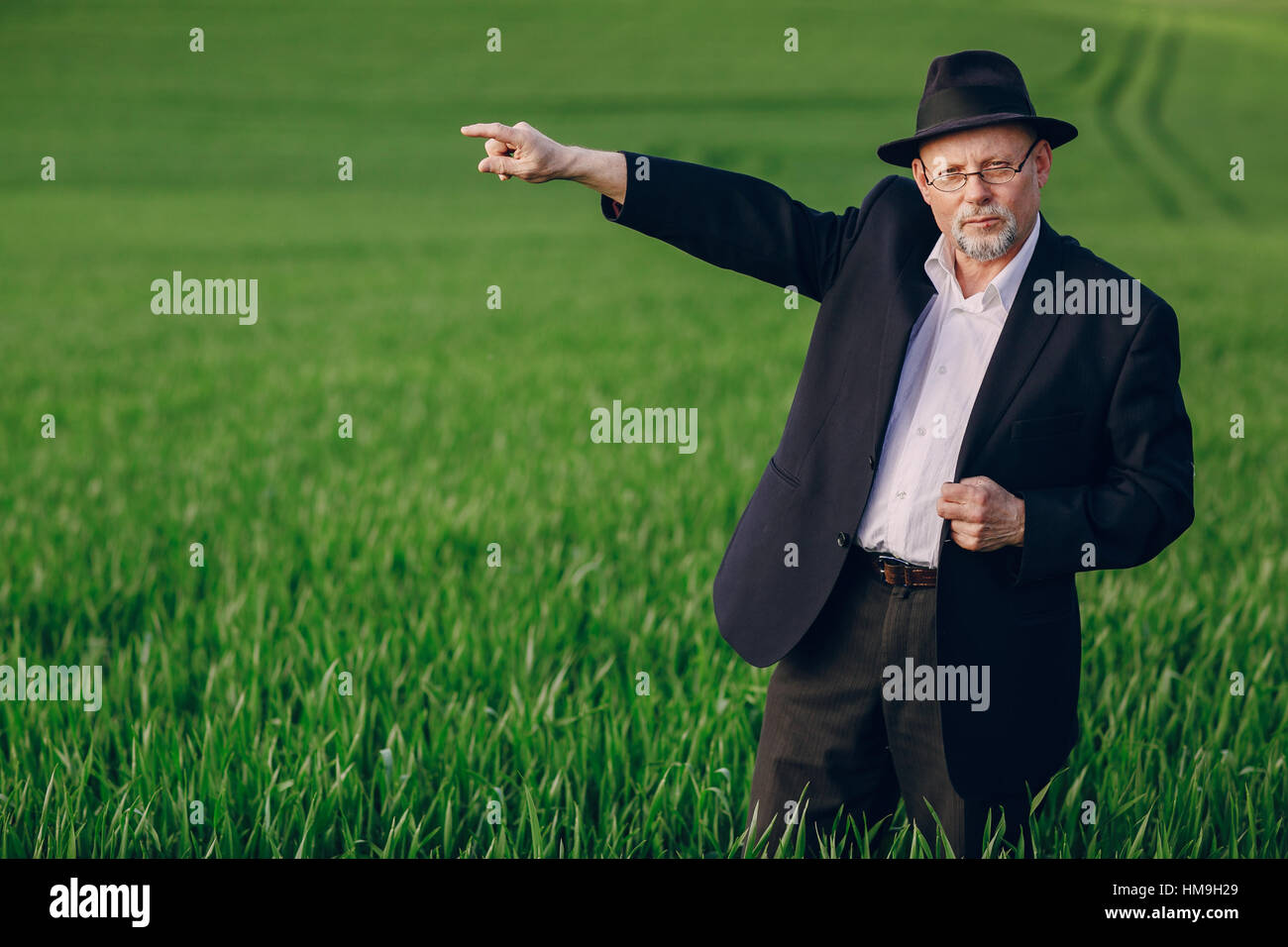 old man in field Stock Photo - Alamy