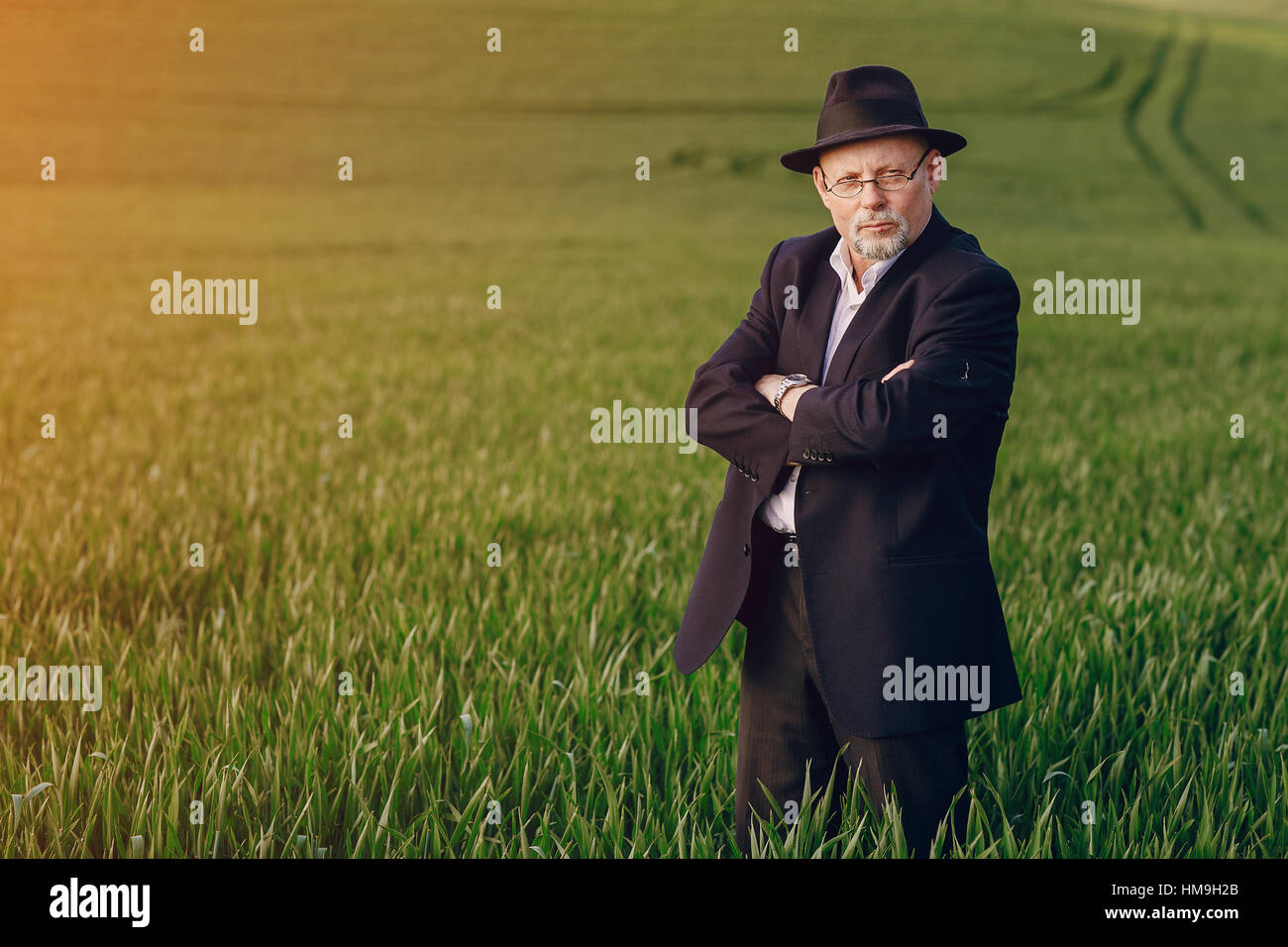 old man in field Stock Photo - Alamy