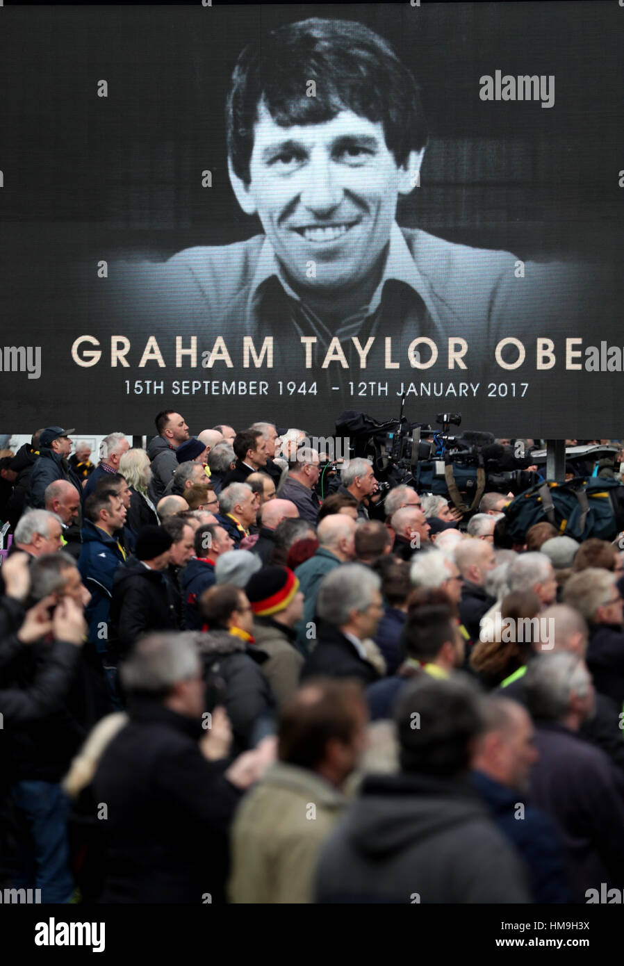People gather outside the church for the funeral service of Graham ...