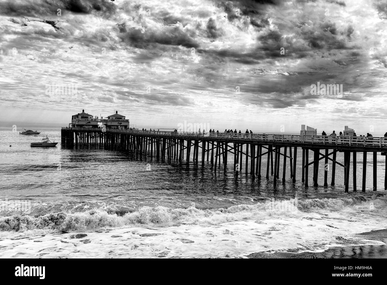 Malibu Pier in beautiful day - Big wave rushing under bridge( B & W ver ...