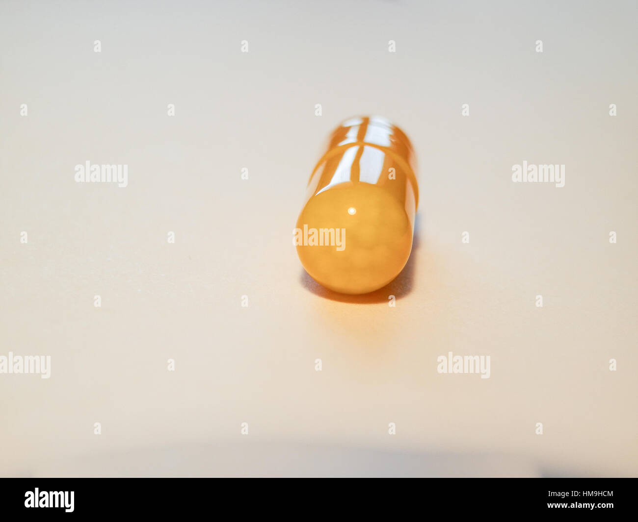 Single medicine drug pill yellow hi-res stock photography and images ...