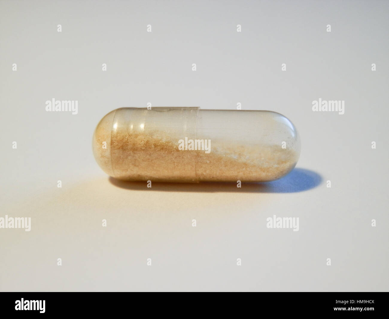 Single medicine drug pill brown oval one. 2 Stock Photo - Alamy
