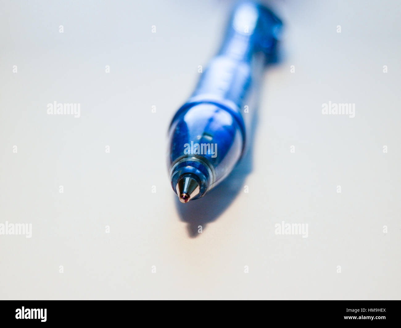 Sharp blue plastic pen macro on white backround. 2 Stock Photo - Alamy