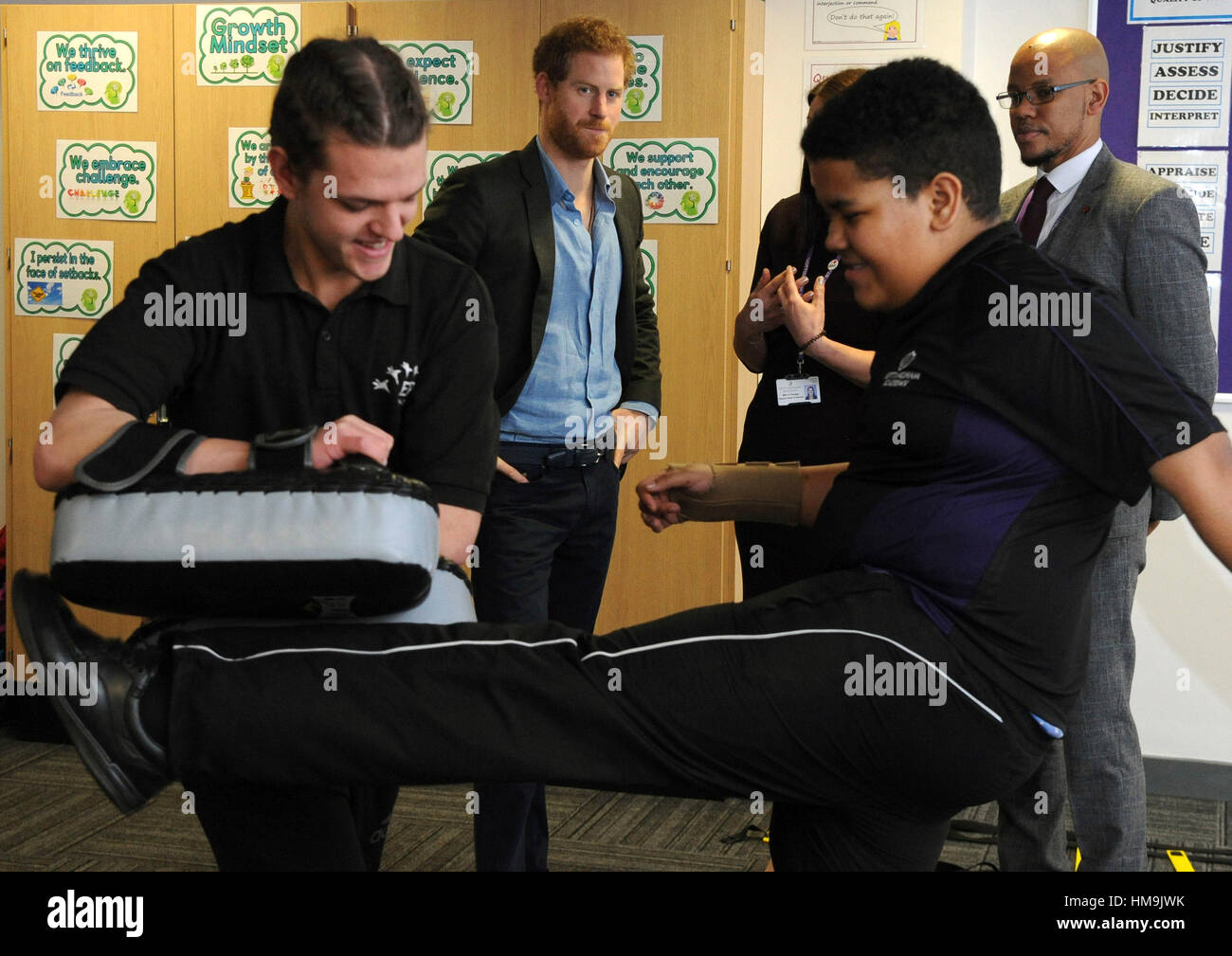 Prince Harry attends a kickboxing class during a visit to the Full ...