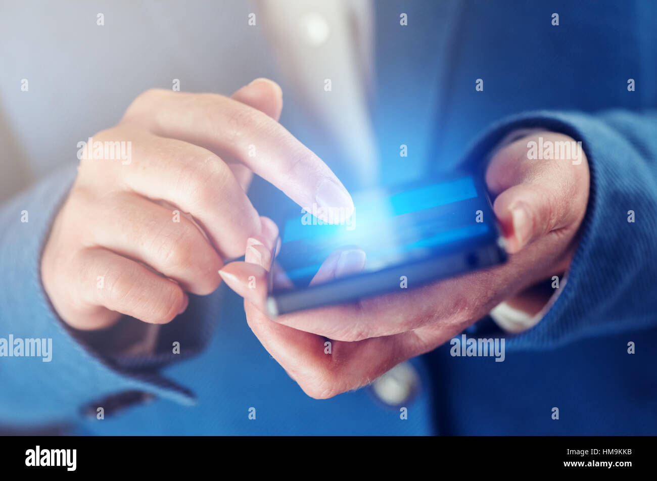 Businesswoman typing SMS message on smart phone device, business ...