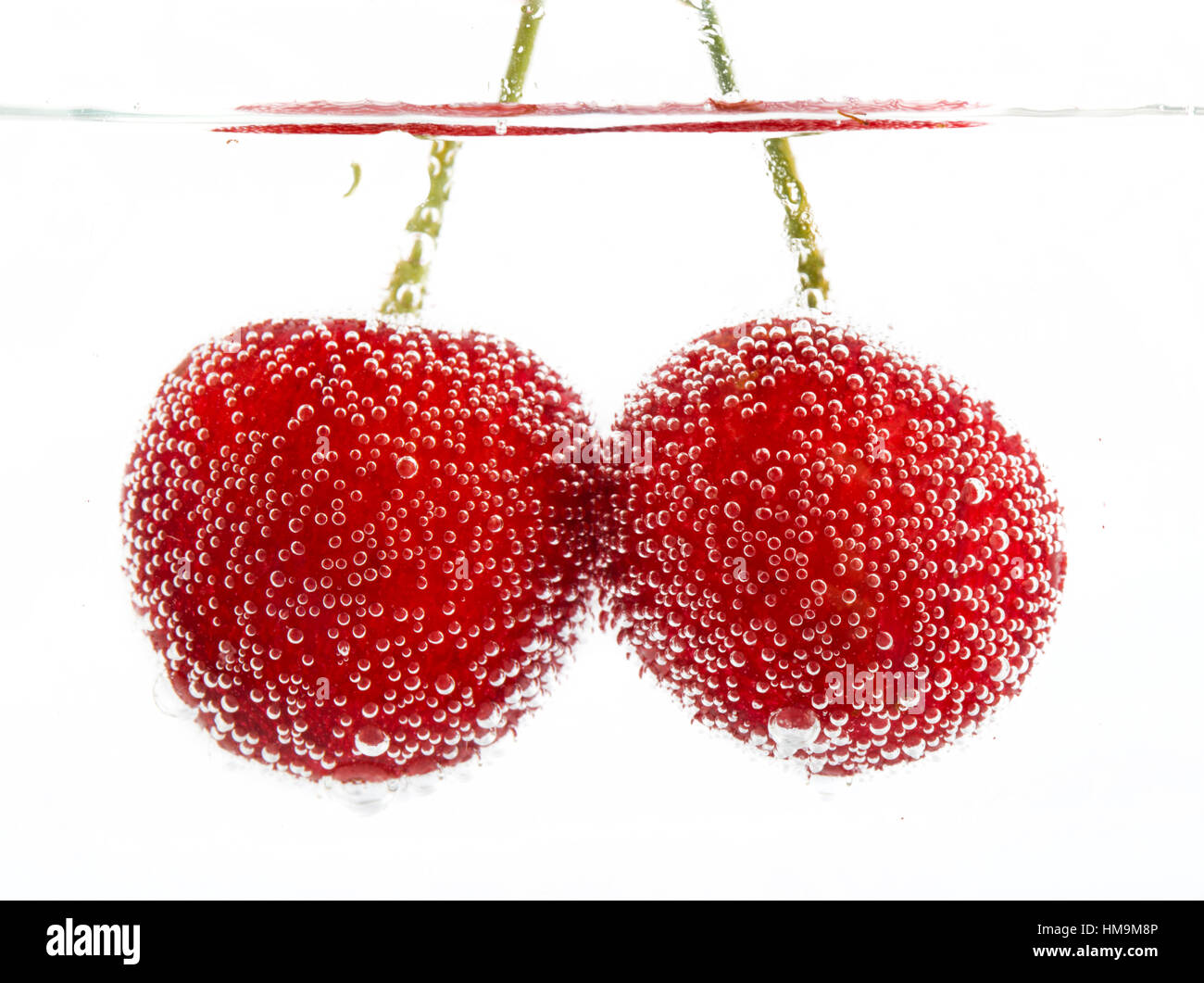 Cherry splash in transparent water hi-res stock photography and images ...