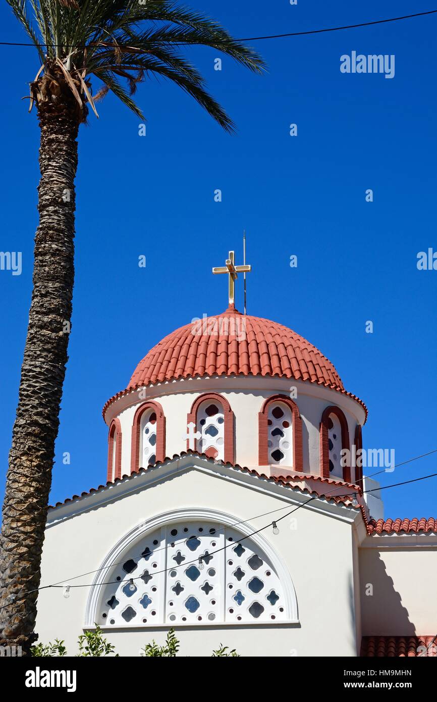 Greek church with a dome and cross in the town centre, Elounda, Crete ...