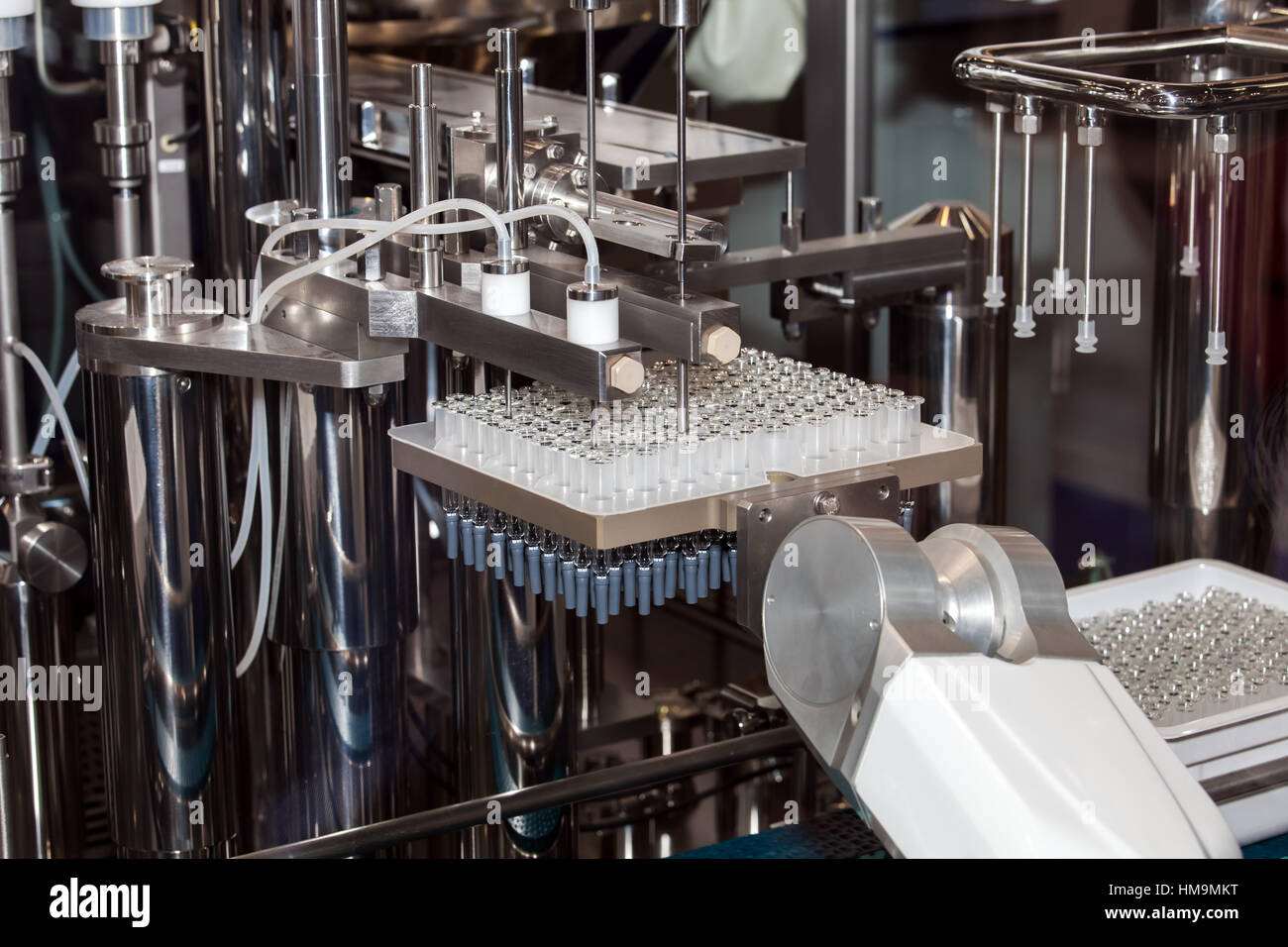 Ampoule filling and sealing machine Stock Photo - Alamy