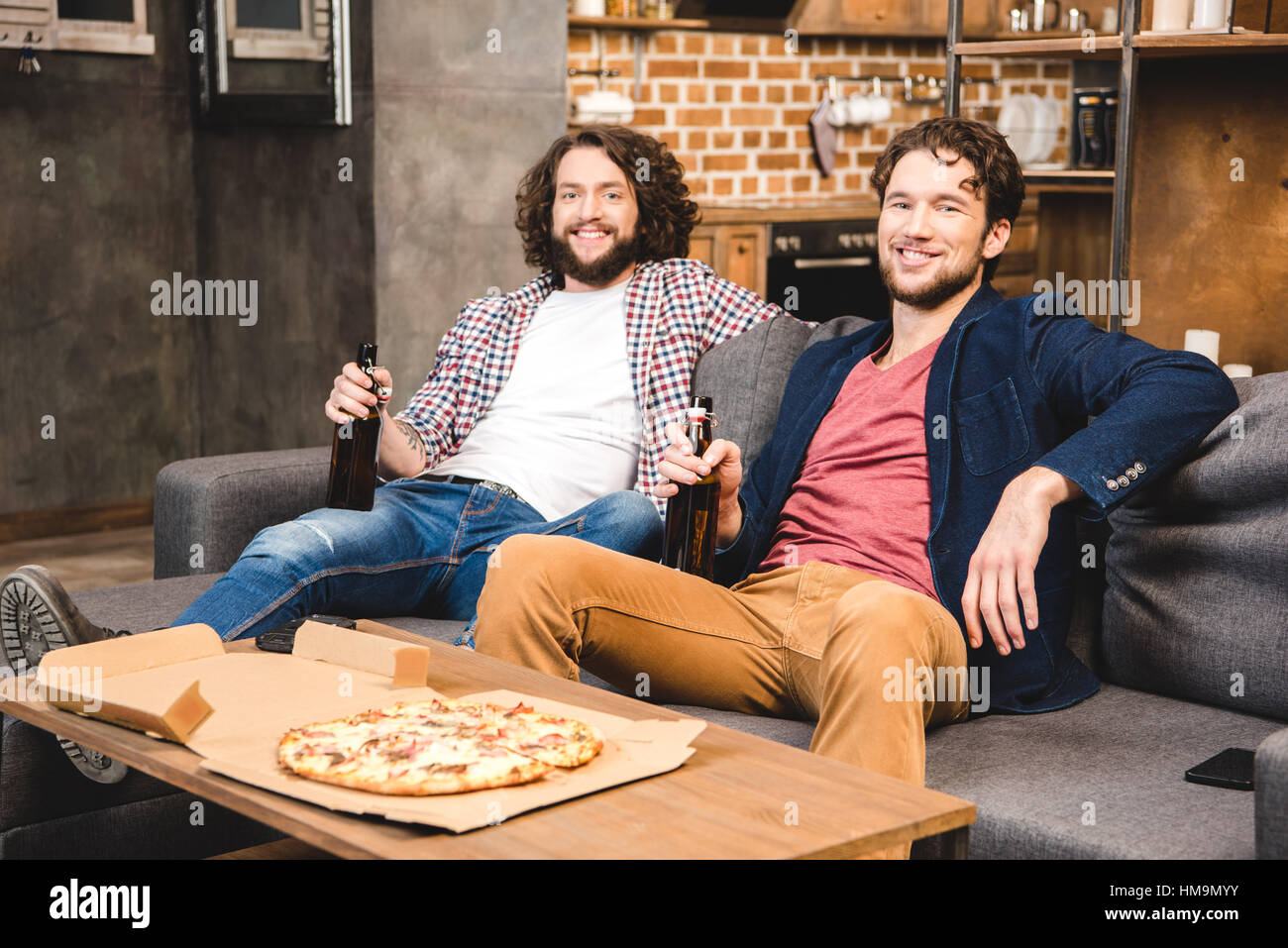 Friends drinking beer Stock Photo - Alamy