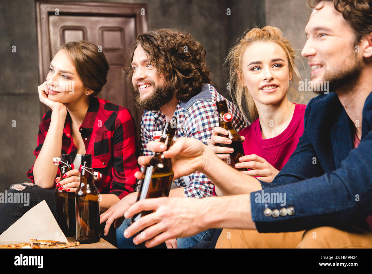 Friends drinking beer Stock Photo - Alamy
