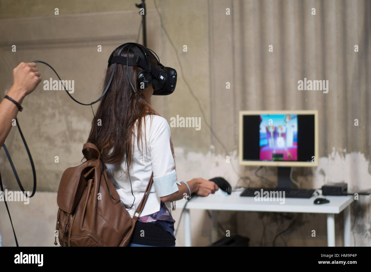 Young girl testing virtual reality equipments at a public place Stock ...