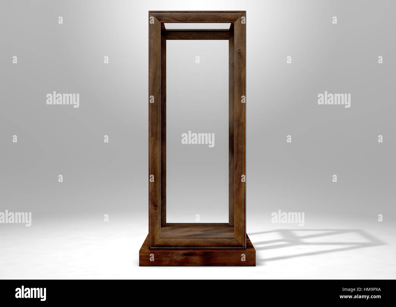 An empty vertical glass display case with a wooden base and frame on an ...