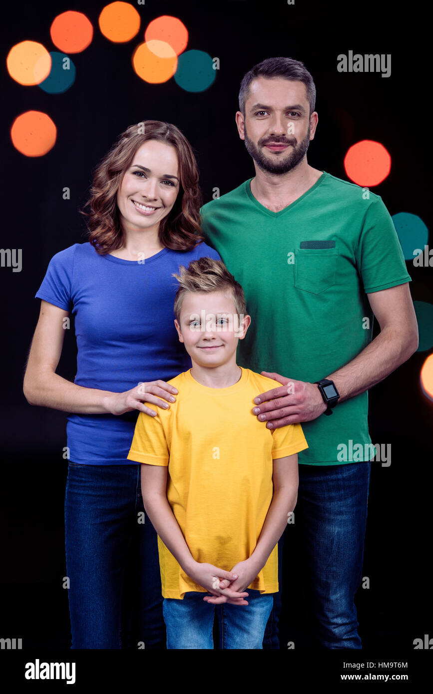 Happy family standing together Stock Photo - Alamy