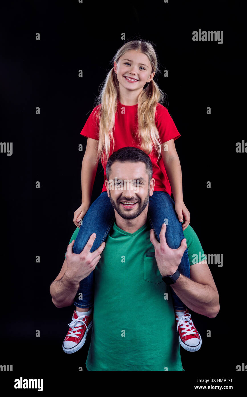 Father carrying daughter on shoulders Stock Photo - Alamy