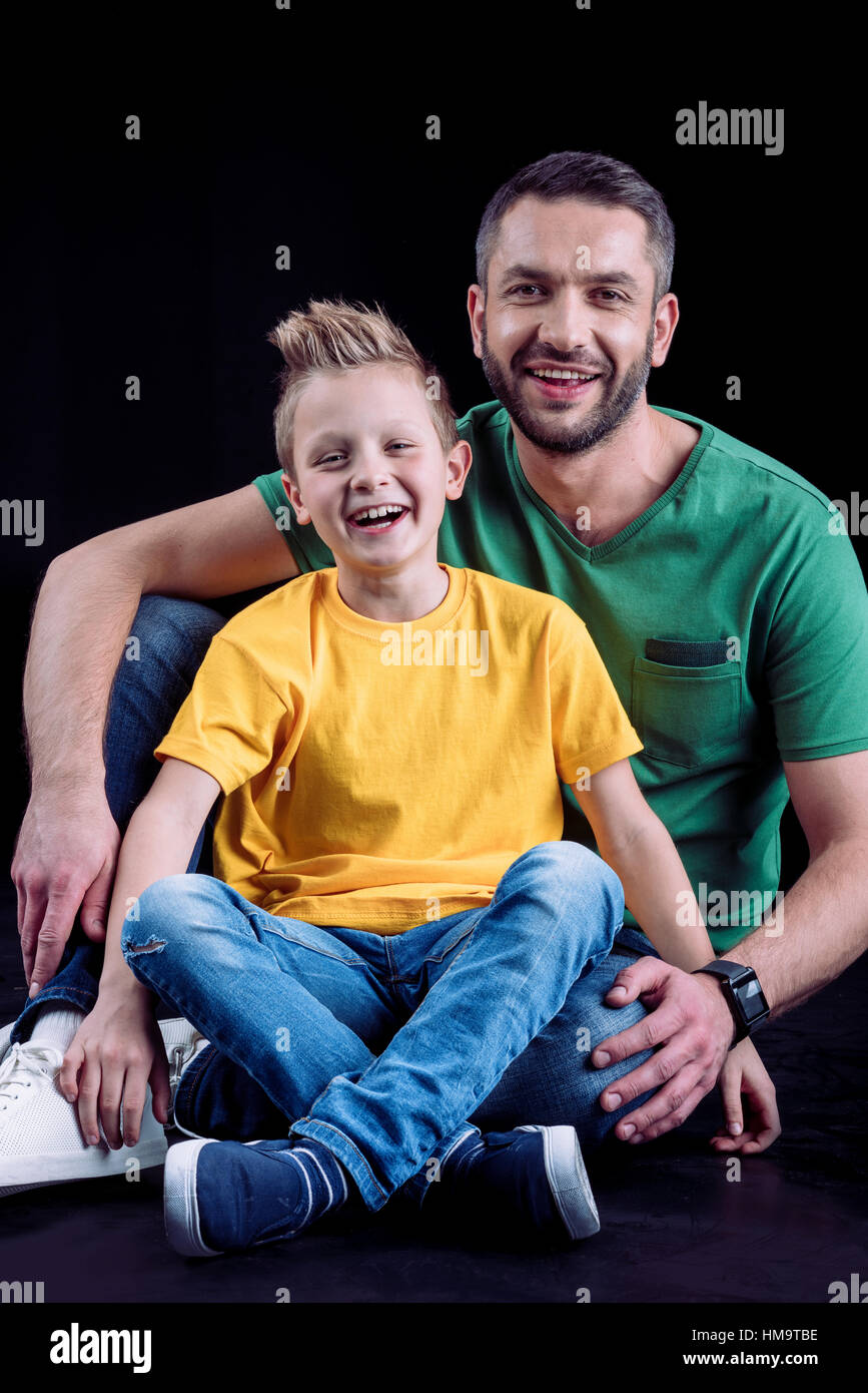 Father and son smiling at camera Stock Photo - Alamy
