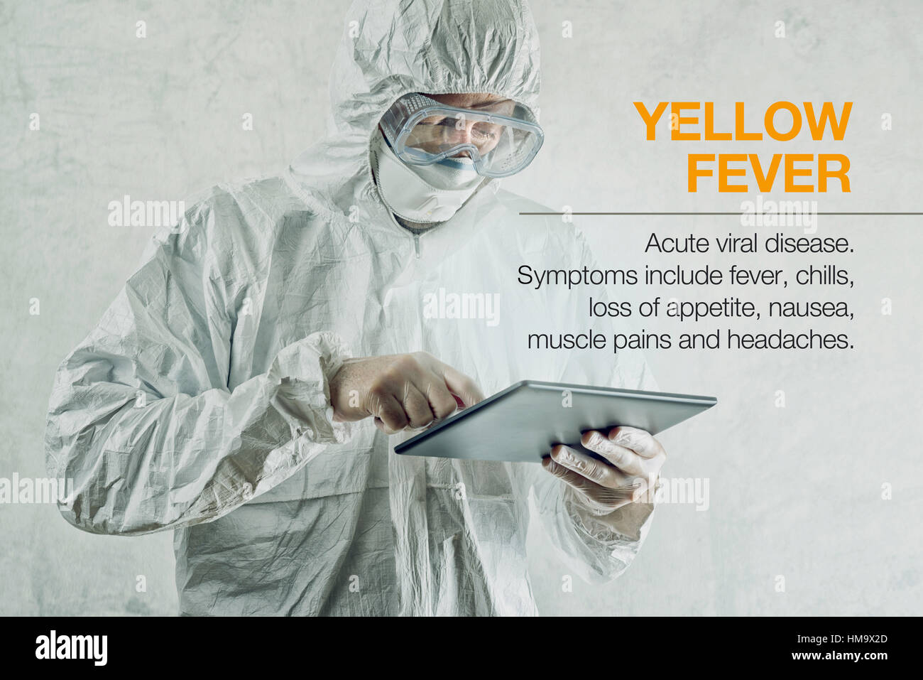 Medical scientist using tablet computer to get informed about yellow ...
