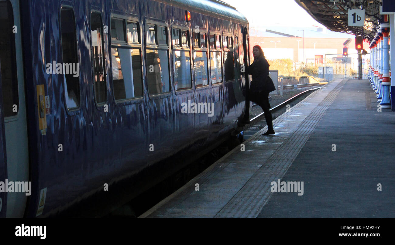 The guard boarding her Northern train service at Middlesbrough station ...