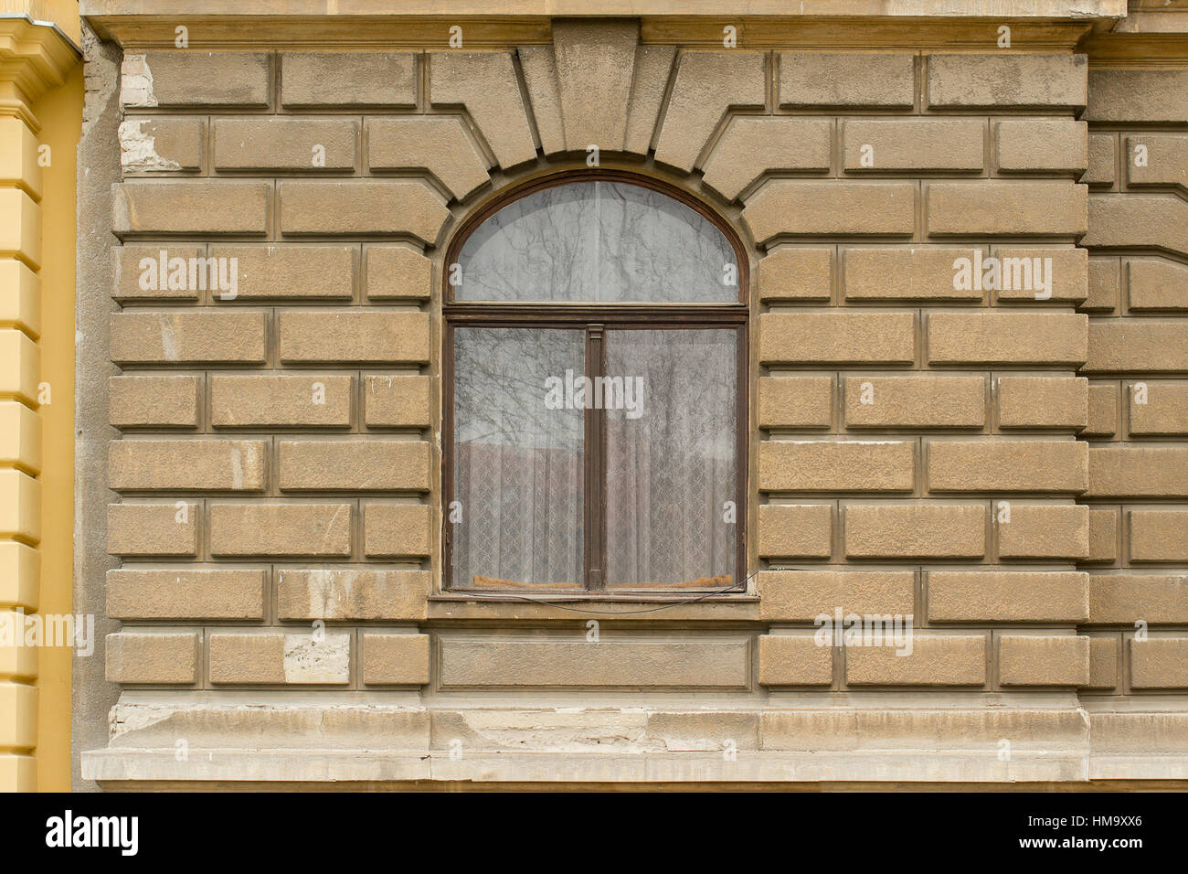 Retro looking window on a brown facade Stock Photo - Alamy