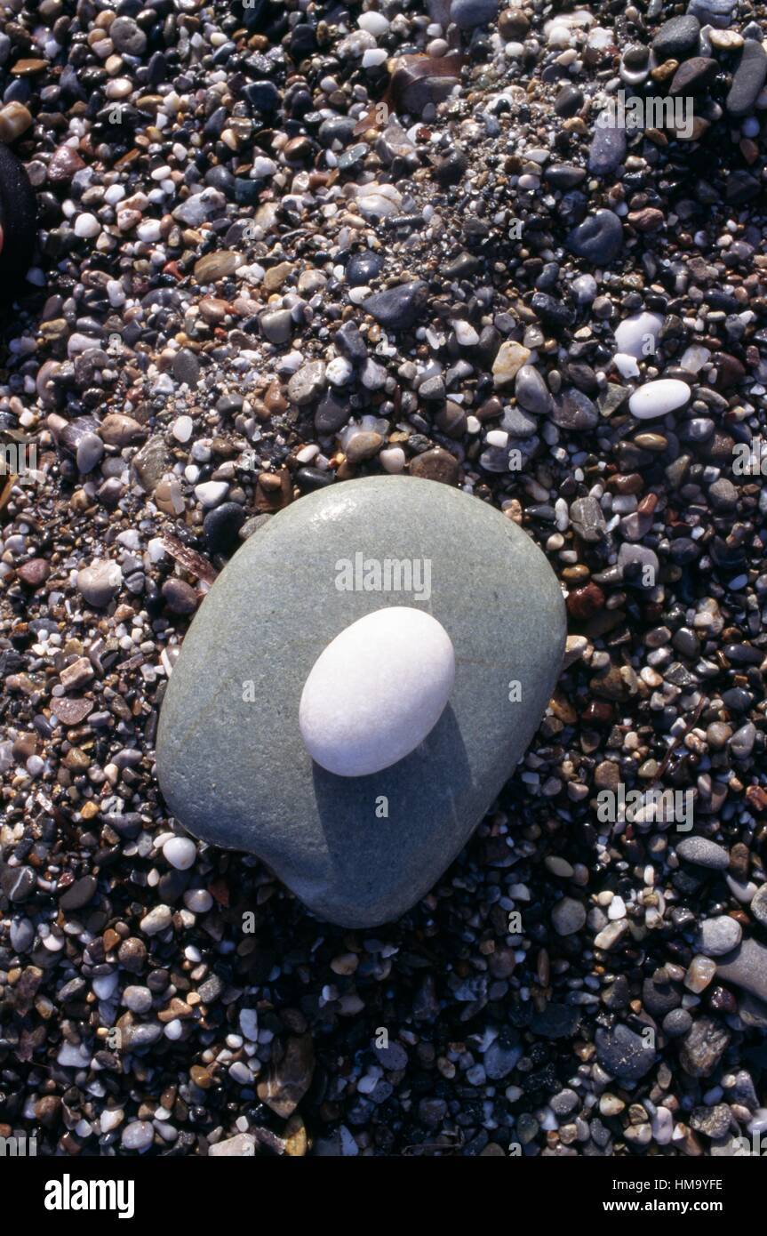White rock on a larger grey rock sitting on gravel, Crete, Greece Stock ...