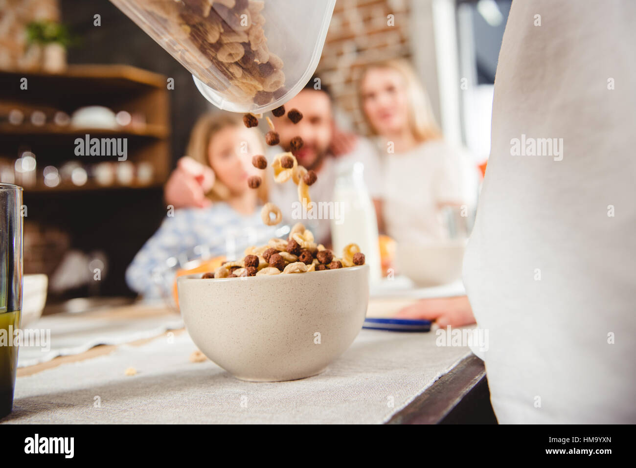 Pouring corn flake rings Stock Photo - Alamy