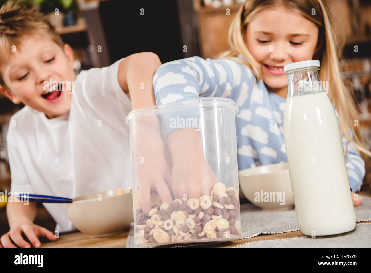 Siblings have breakfast Stock Photo - Alamy