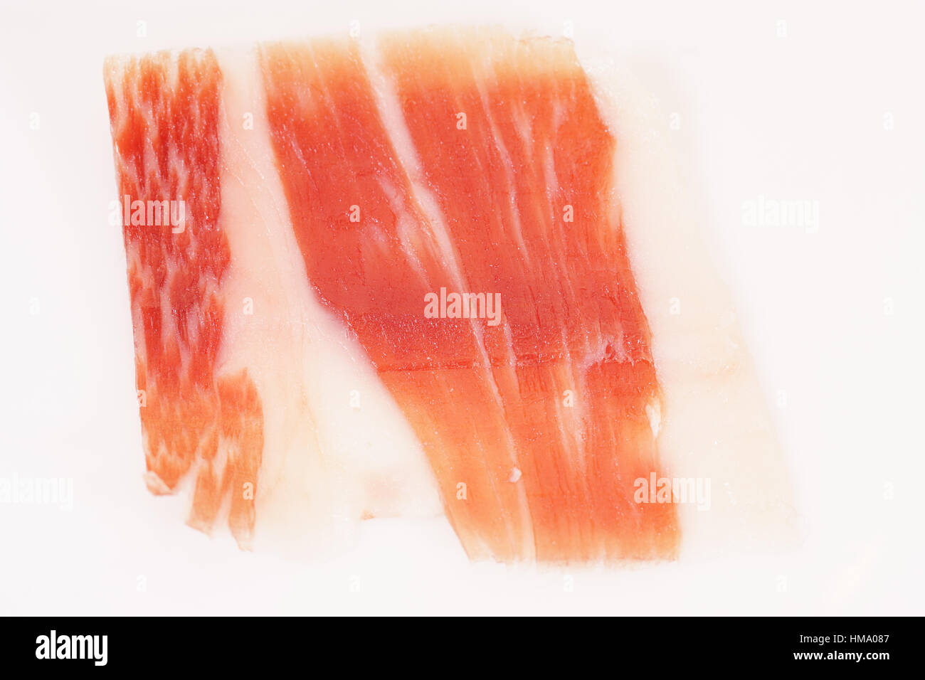 Serrano ham slice closeup Stock Photo - Alamy