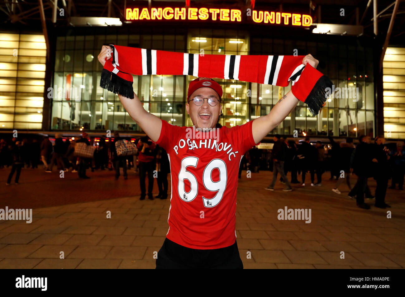 A Manchester United fan outside Old Trafford before the Premier League ...