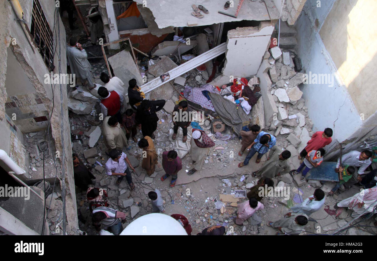 People are gathering at venue after building collapsed, in Neelum ...