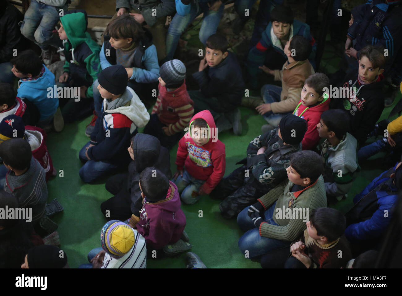 Orphan Syrian children in a playground build underground to protect ...
