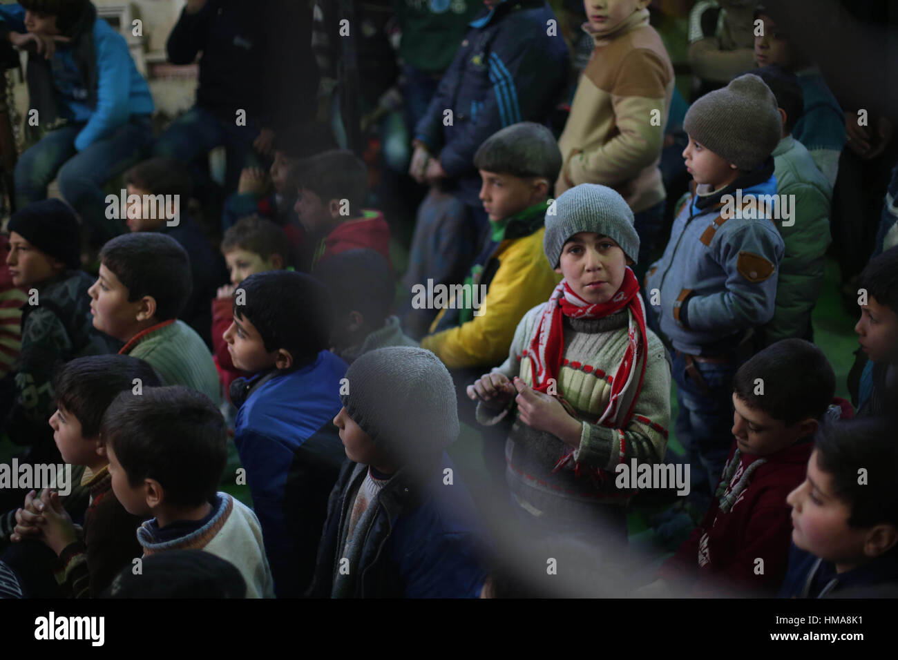 Orphan Syrian children in a playground build underground to protect ...