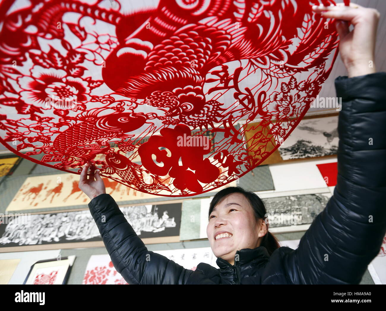 Beijing, China's Hebei province. 17th Jan, 2017. A woman shows her ...
