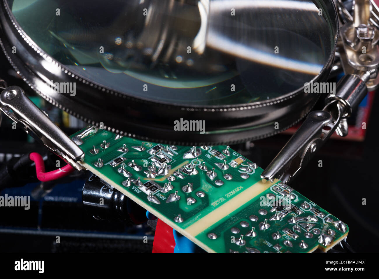 assembly of electronic circuit board on the pasteboard. low key Stock ...