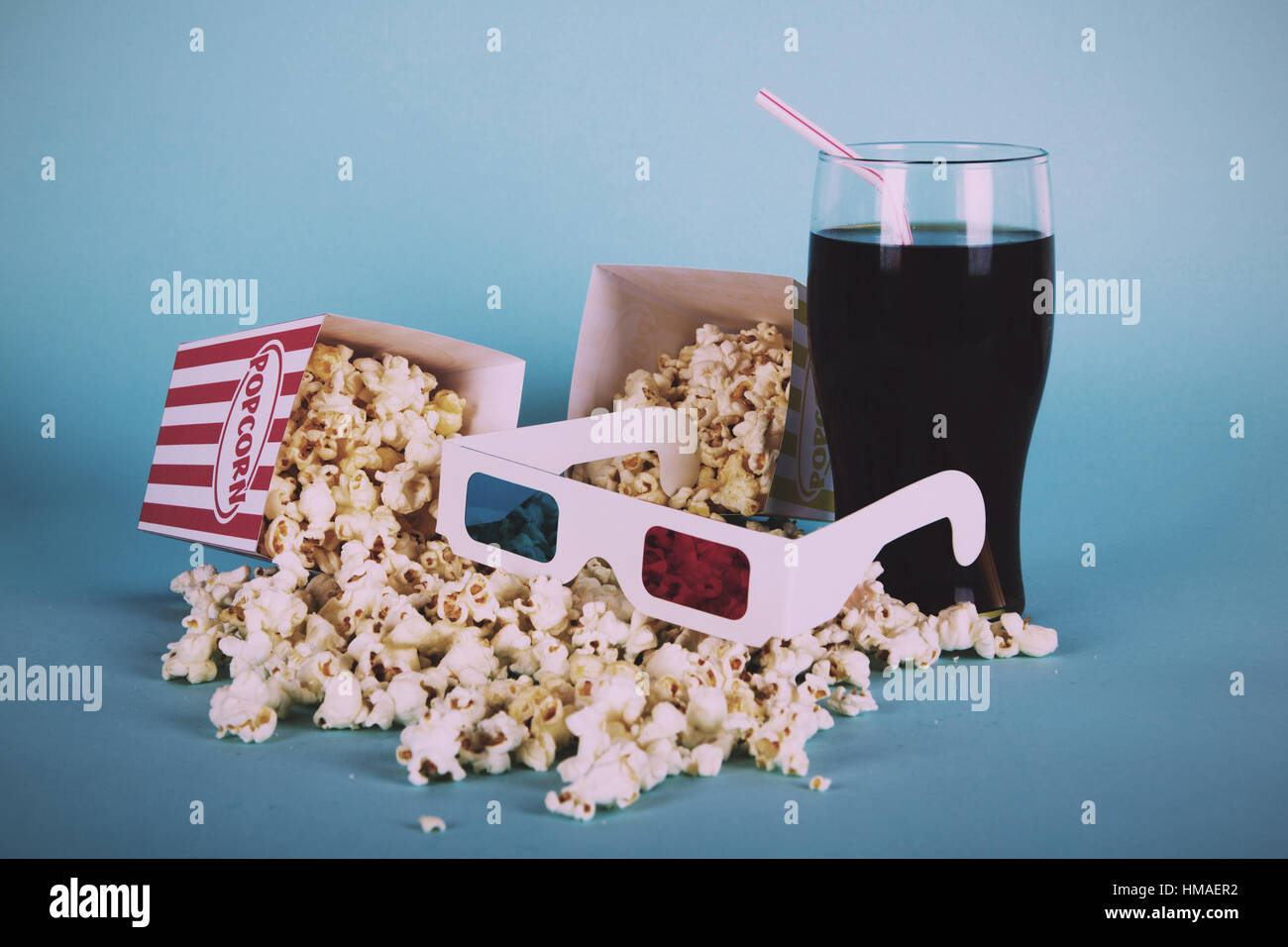 Bucket of popcorn against a blue background Vintage Retro Filter Stock ...