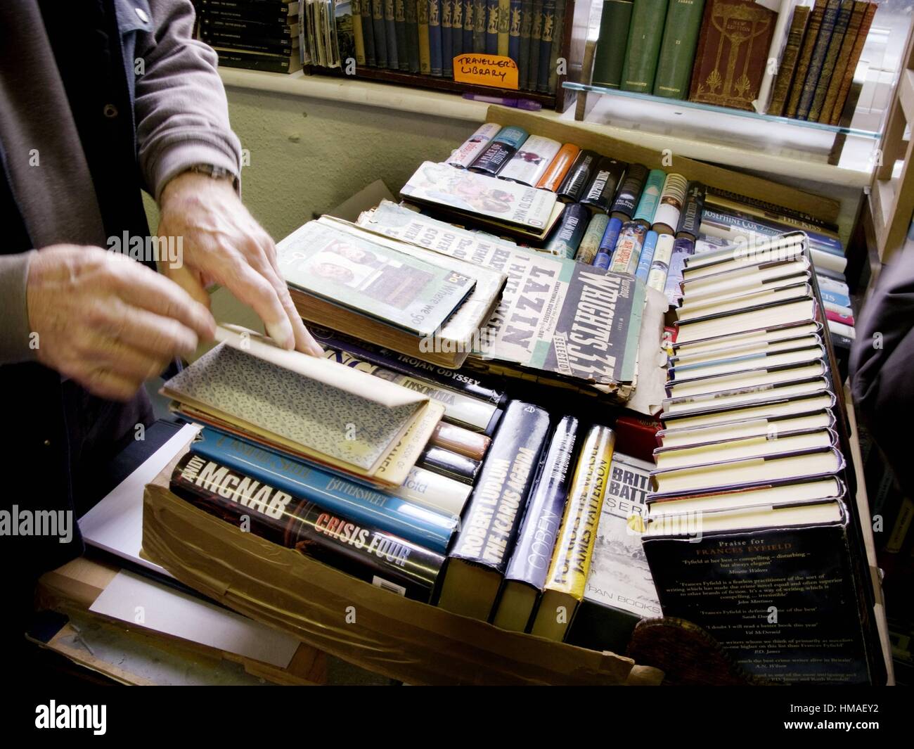 Used books close up hand hi-res stock photography and images - Alamy
