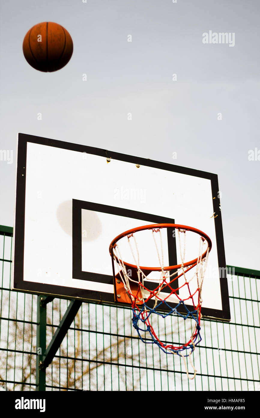 Basketball hoop outside in a school play area Stock Photo - Alamy