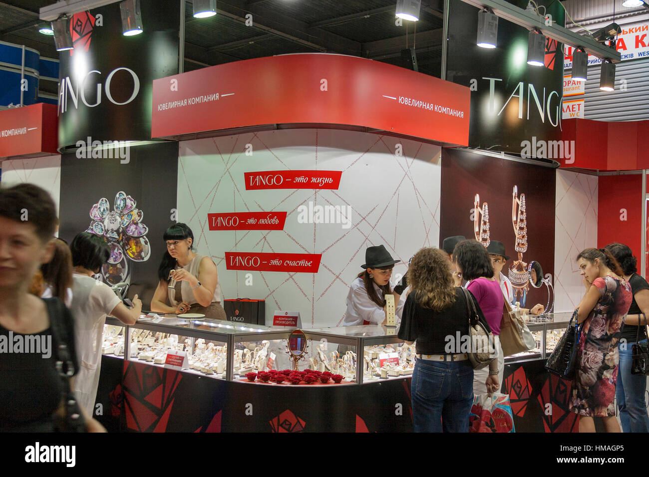 Visitors visit Tango Jewelry company booth with presenters during ...