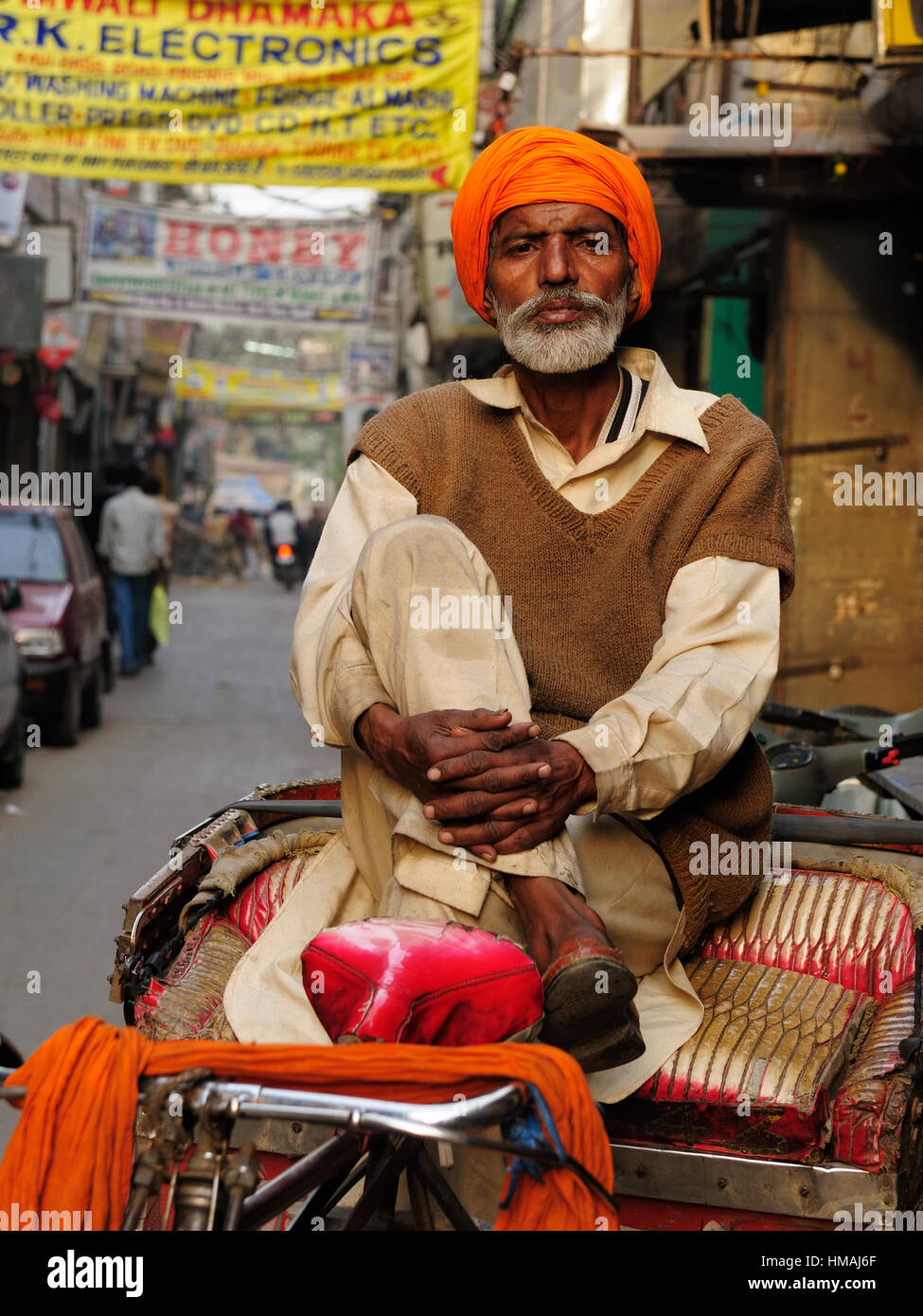 INDIA, AMRITSAR - NOVEMBER 29: Rickshaw driver with one's rickshaw in ...
