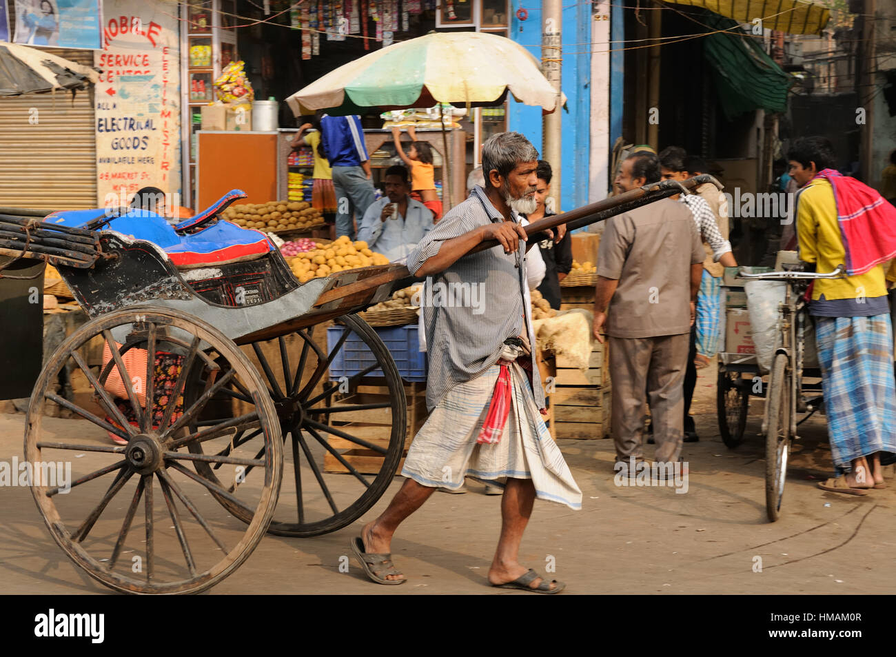 KOLKATA, INDIA - DECEMBER 14: Rickshaw driver with one's rickshaw in ...