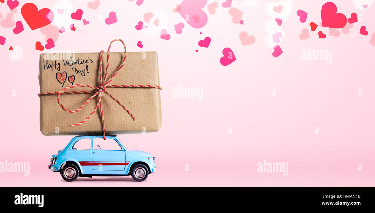 Retro toy car with Valentine heart Stock Photo - Alamy