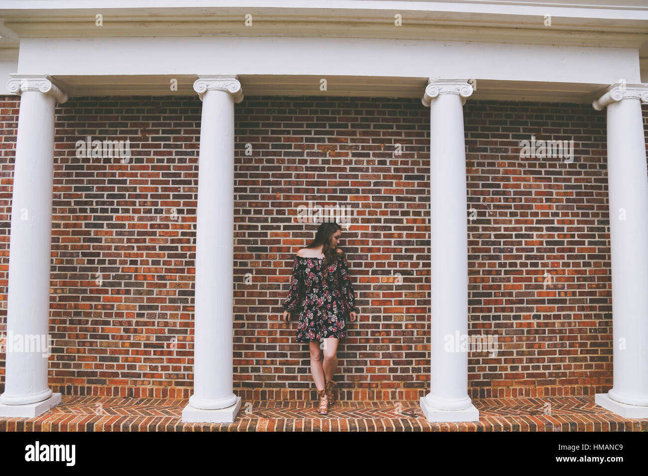 Girl by Brick Wall Stock Photo - Alamy