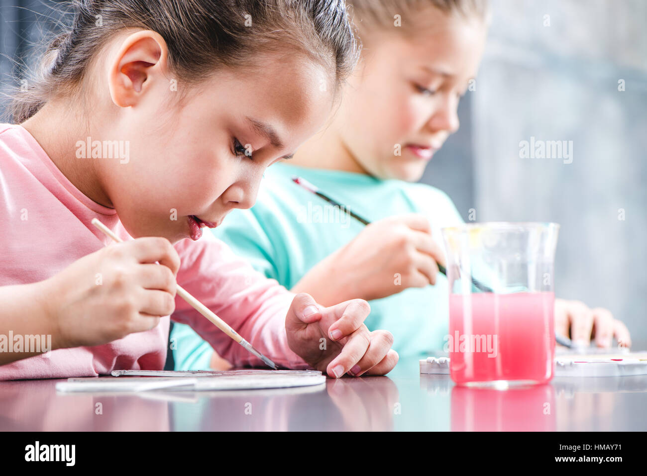 Children painting on paper Stock Photo - Alamy