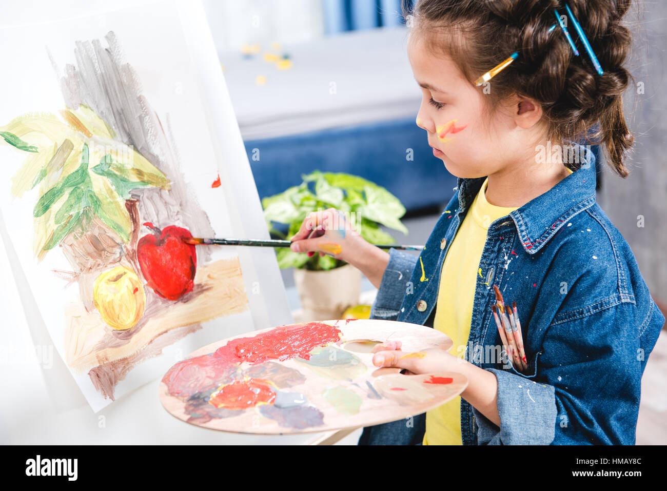 Little artist painting Stock Photo - Alamy