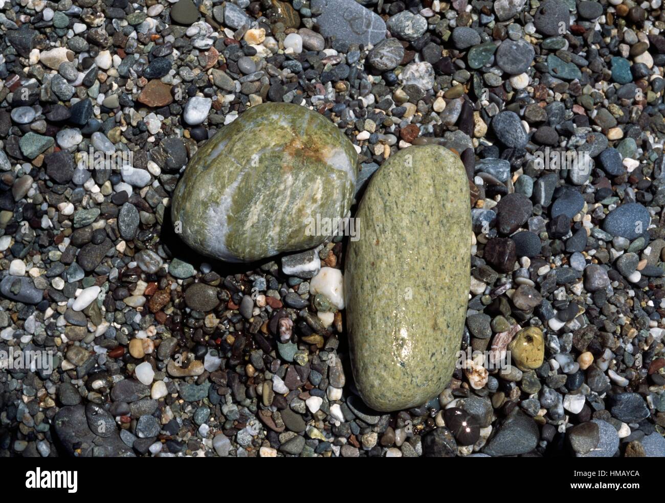 Speckled and mottled rocks on gravel, Keratokambos, Crete, Greece Stock ...