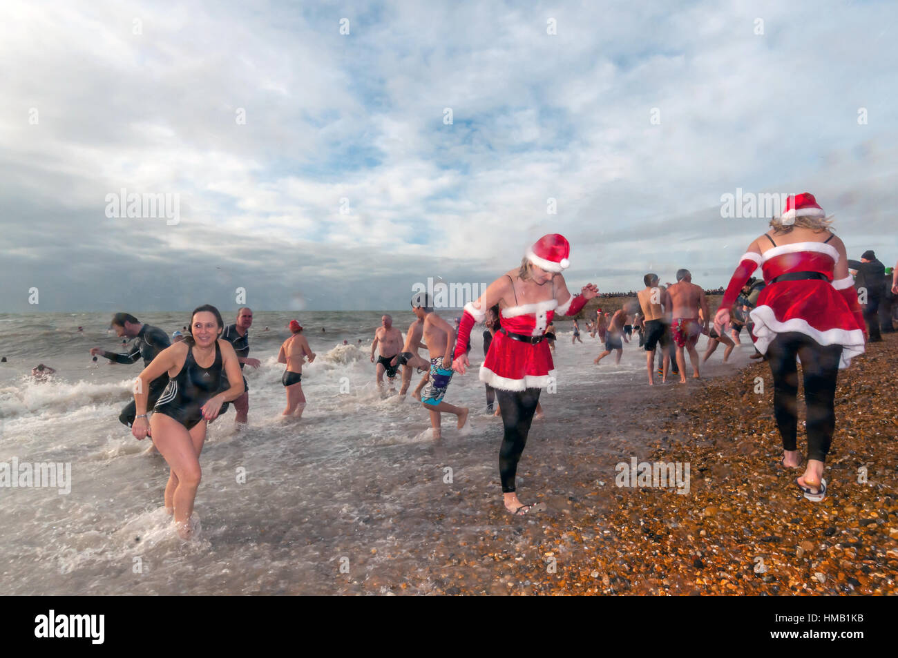 Swimmers enjoying a traditional Christmas Day swim on Brighton beach ...